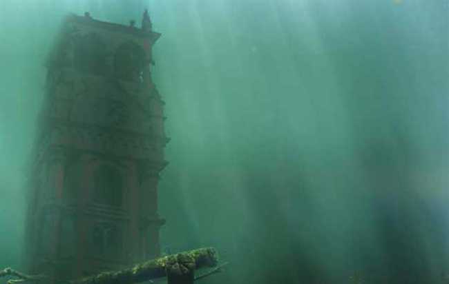 Clock Tower Stands Gracefully In Tehri Lake